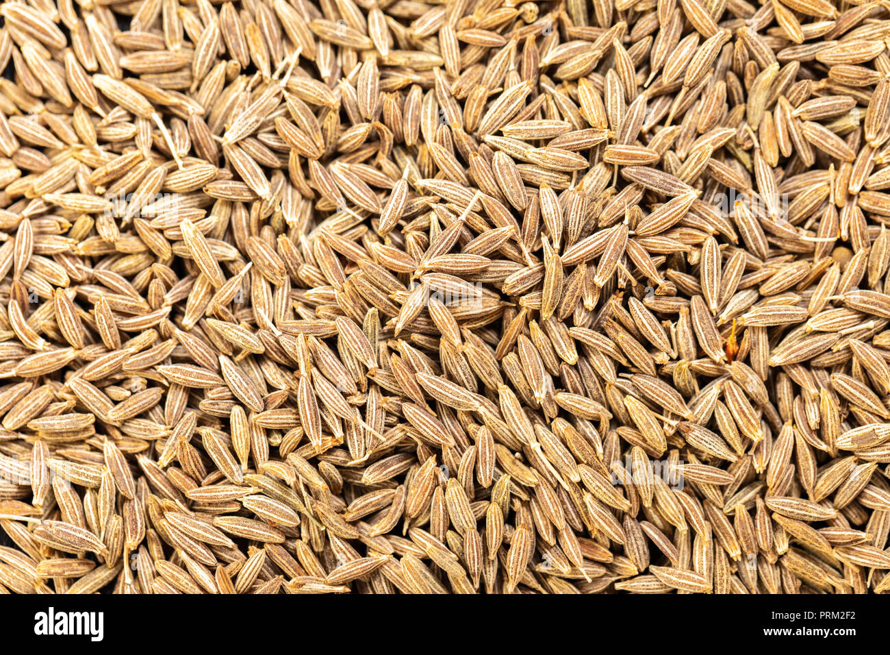 food background texture of dry spices cumin Stock Photo - Alamy