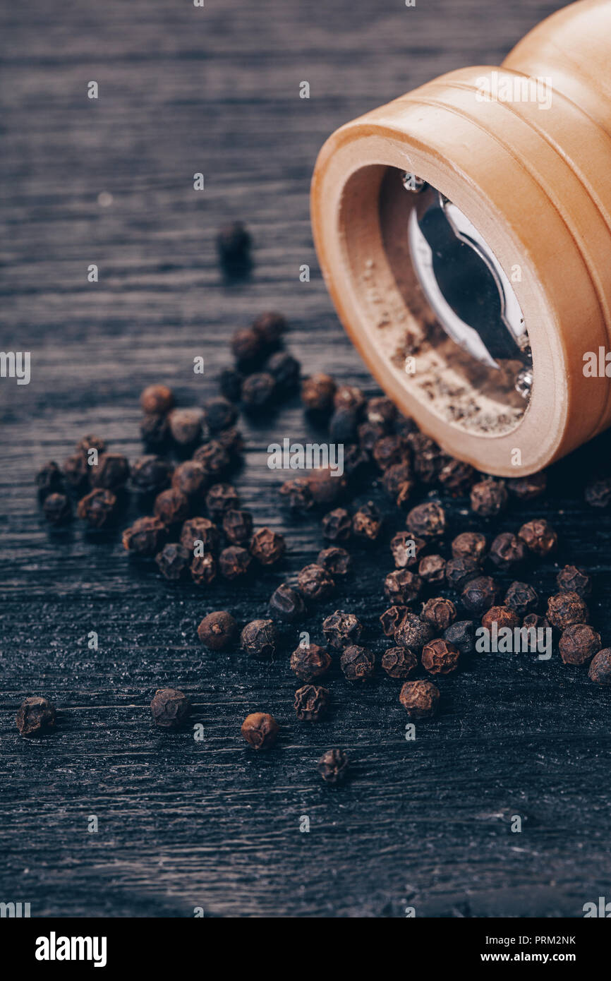 pepper with spices close-up on a black background Stock Photo - Alamy