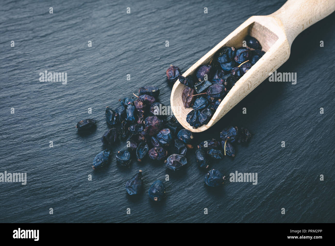 spice dry barberry on black stone background Stock Photo - Alamy