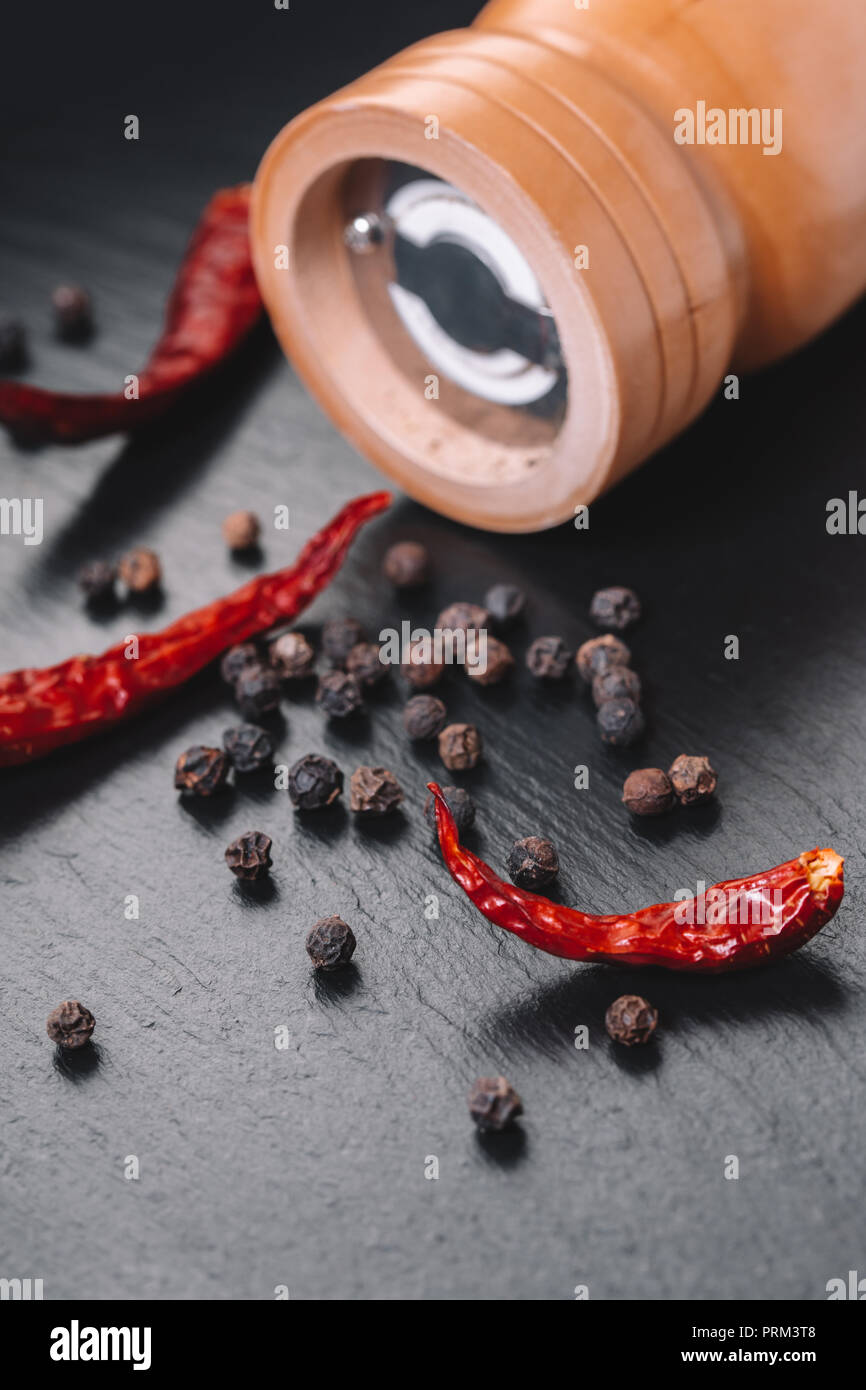 pepper with spices close-up on a black background Stock Photo - Alamy