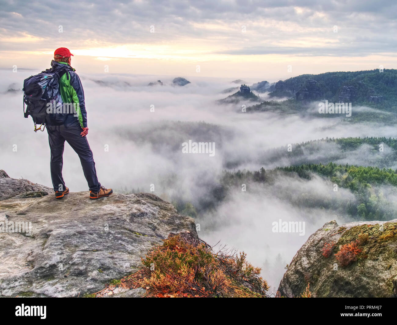 Hiker on sharp cliff of sandstone rock in rock empires park observe ...