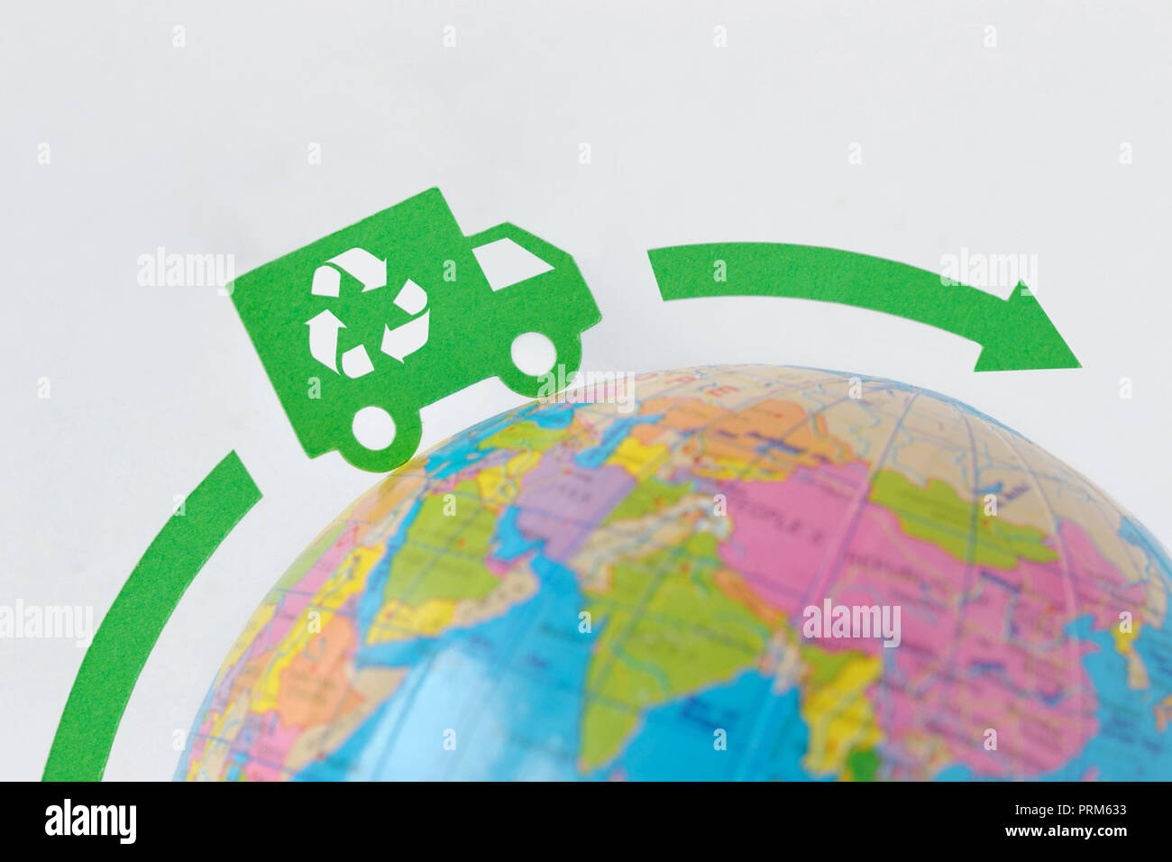 Green truck on earth globe - Ecological transport Stock Photo - Alamy
