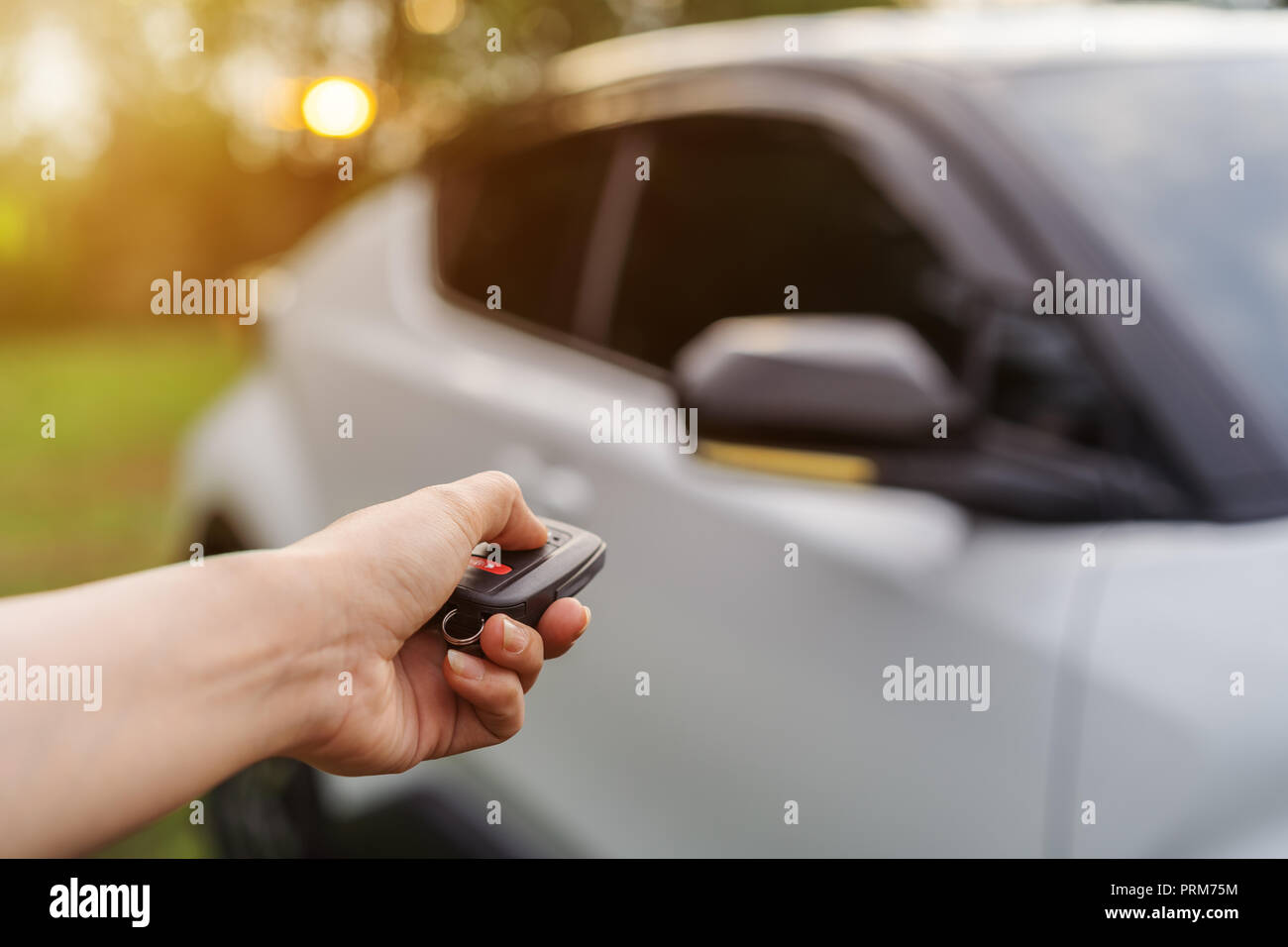 Woman using key unlock hi-res stock photography and images - Alamy