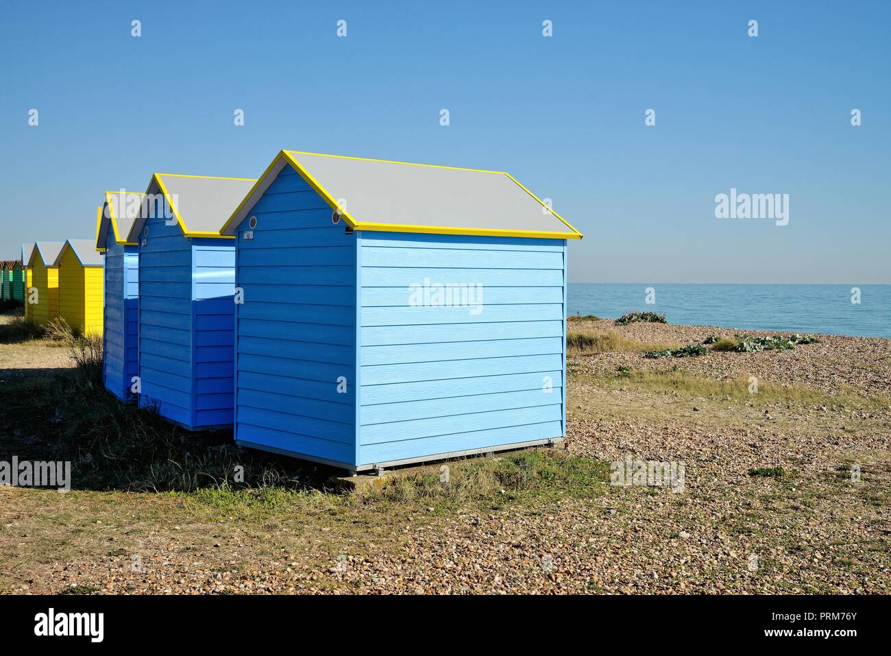 Colourful modern beach huts on the seafront at Littlehampton west ...