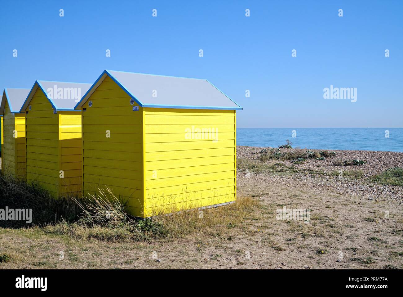 Colourful modern beach huts on the seafront at Littlehampton west ...