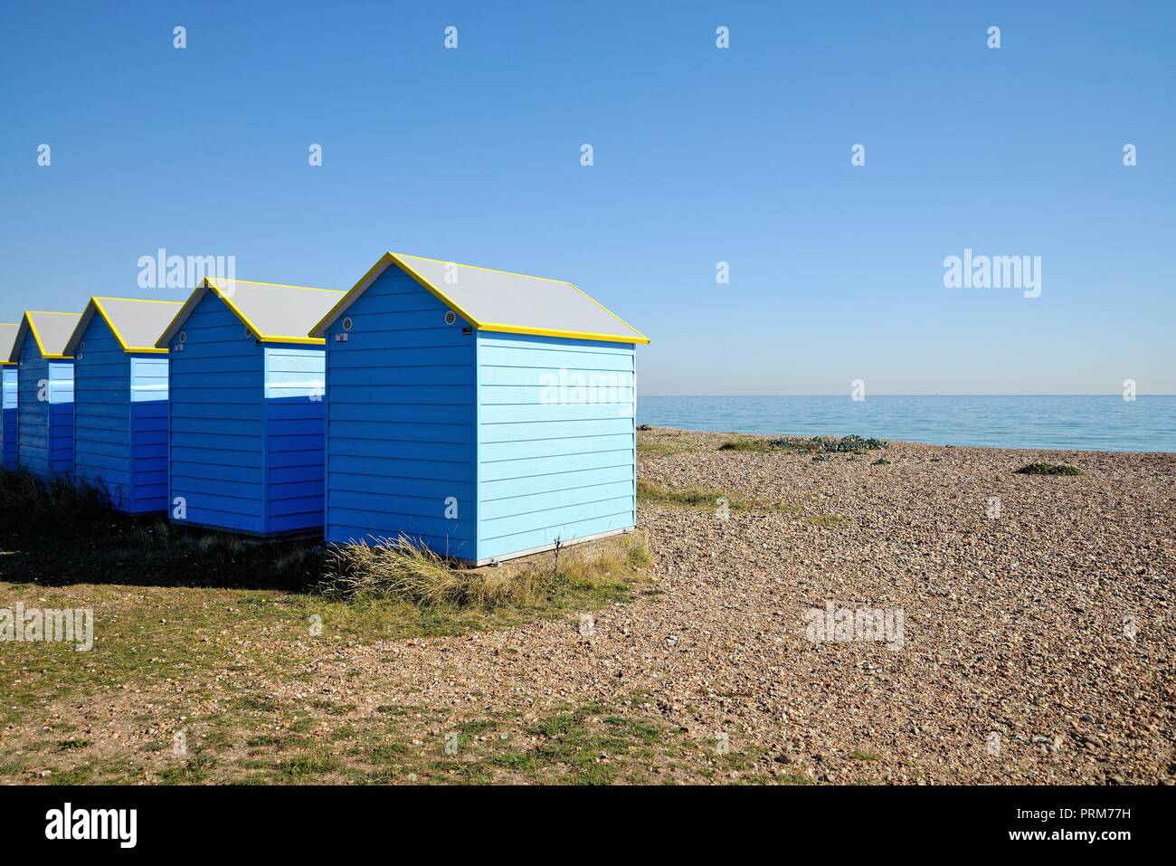 Colourful modern beach huts on the seafront at Littlehampton west ...