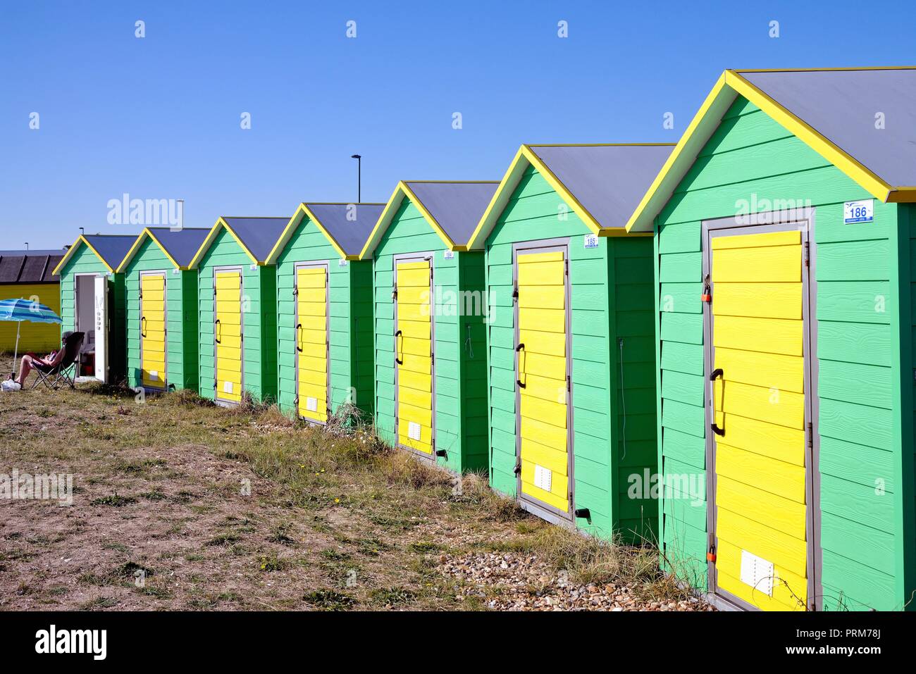 Colourful modern beach huts on the seafront at Littlehampton west ...