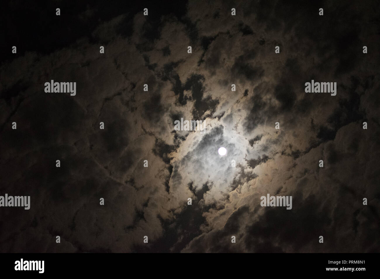 Full moon behind night clouds hi-res stock photography and images - Alamy
