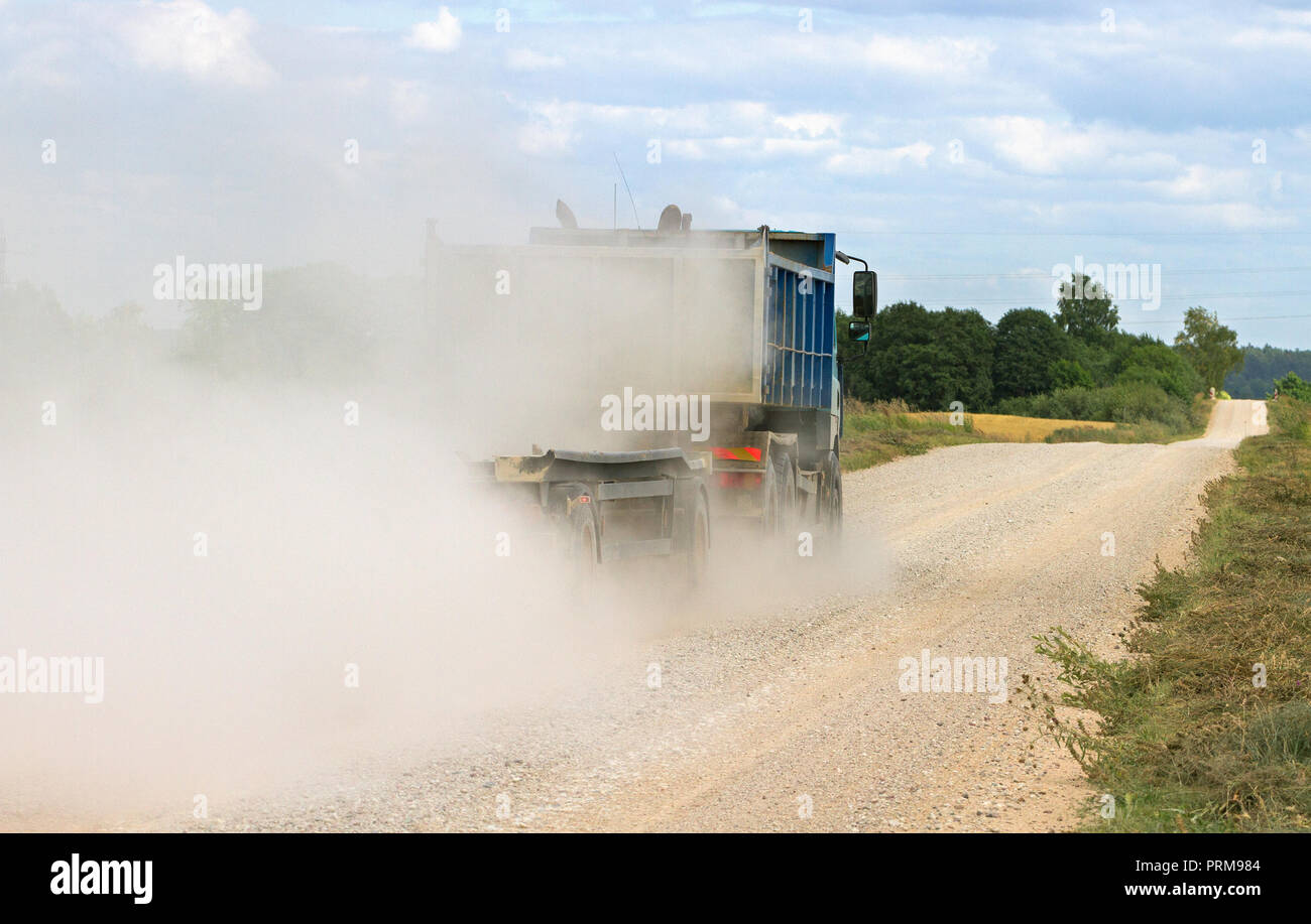 Mist of dust on the country road after big car passing Stock Photo - Alamy