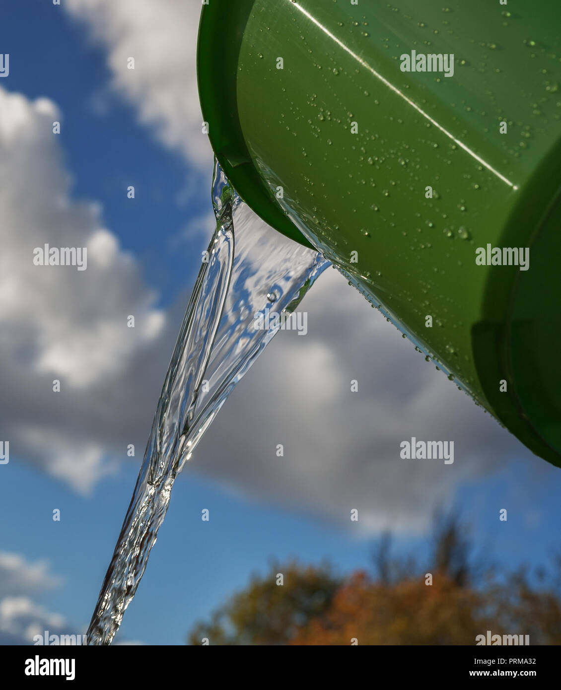 Bucket full of water in countryside Stock Photo - Alamy