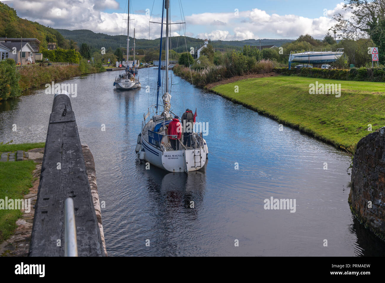Yachts passing through lock gates on the Crinan Canal at Cairnbaan ...