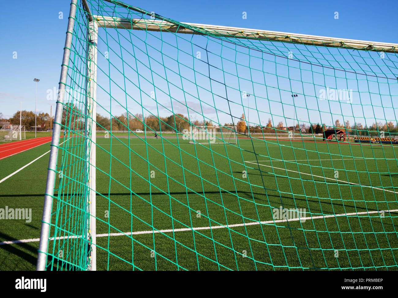 Small stadium outside with fake green grass Stock Photo - Alamy