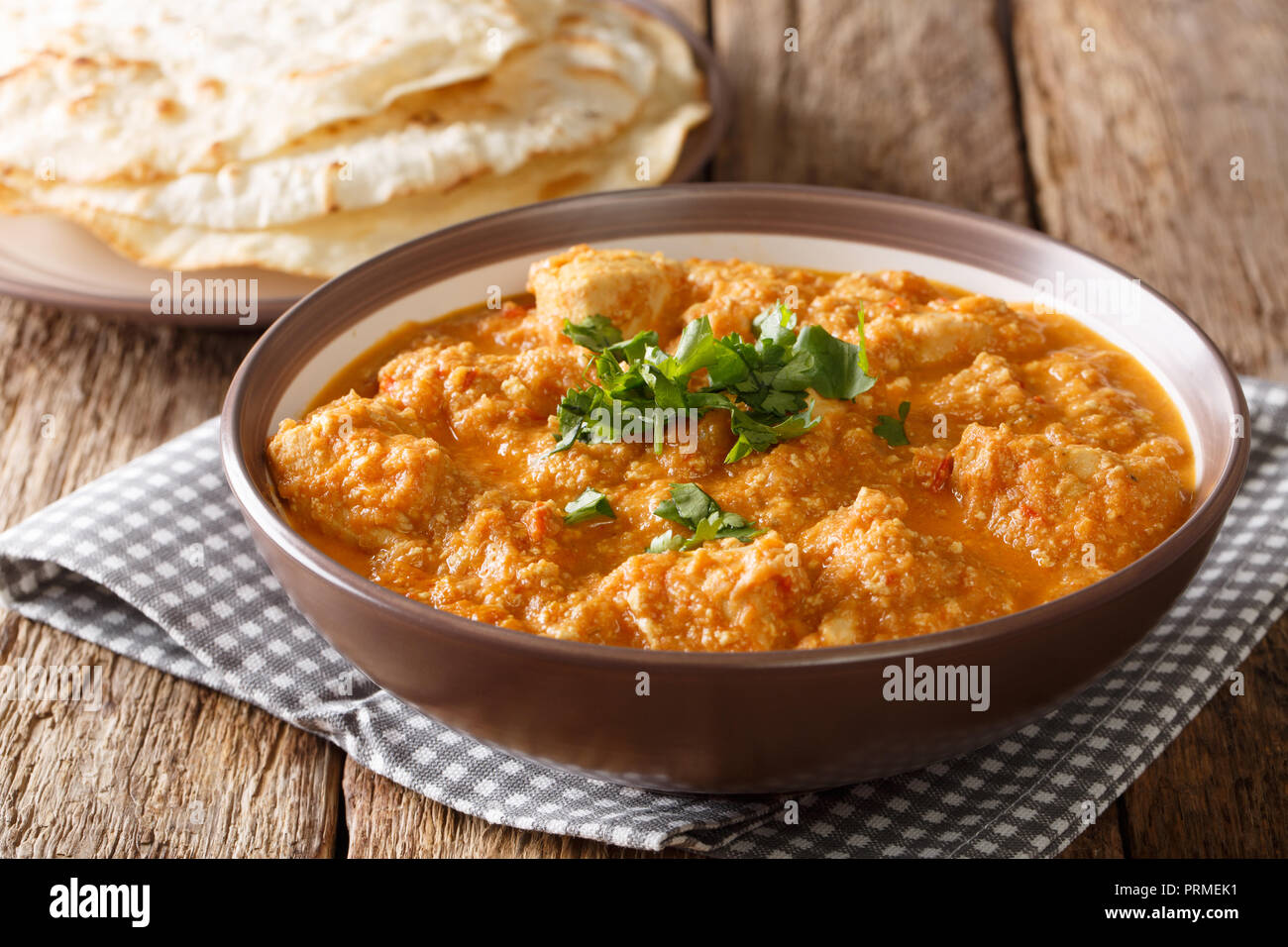 Delicious Indian chicken changezi in a spicy sauce served with flat ...