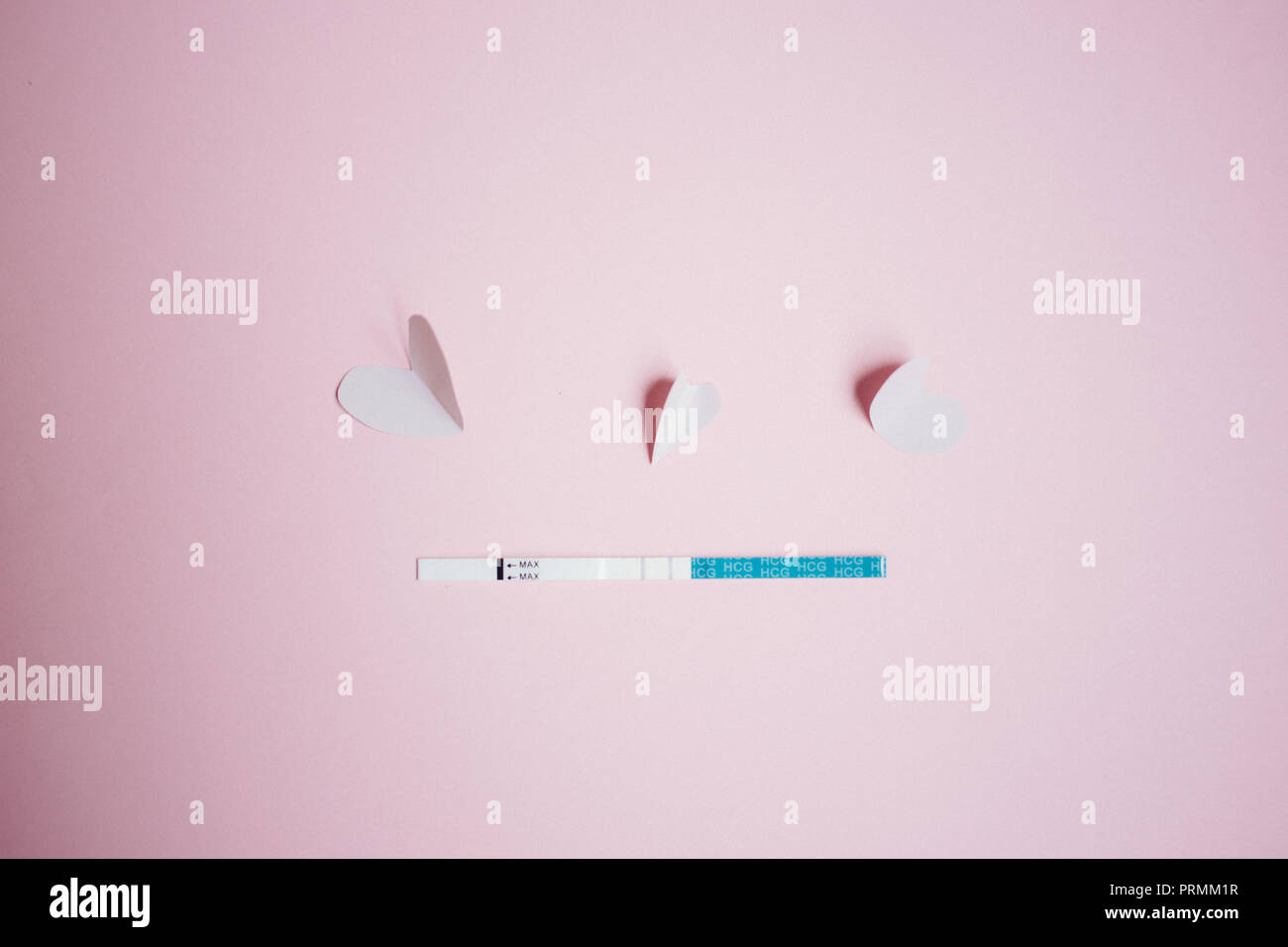 Positive pregnancy test with two strips and pink hearts. pink ...