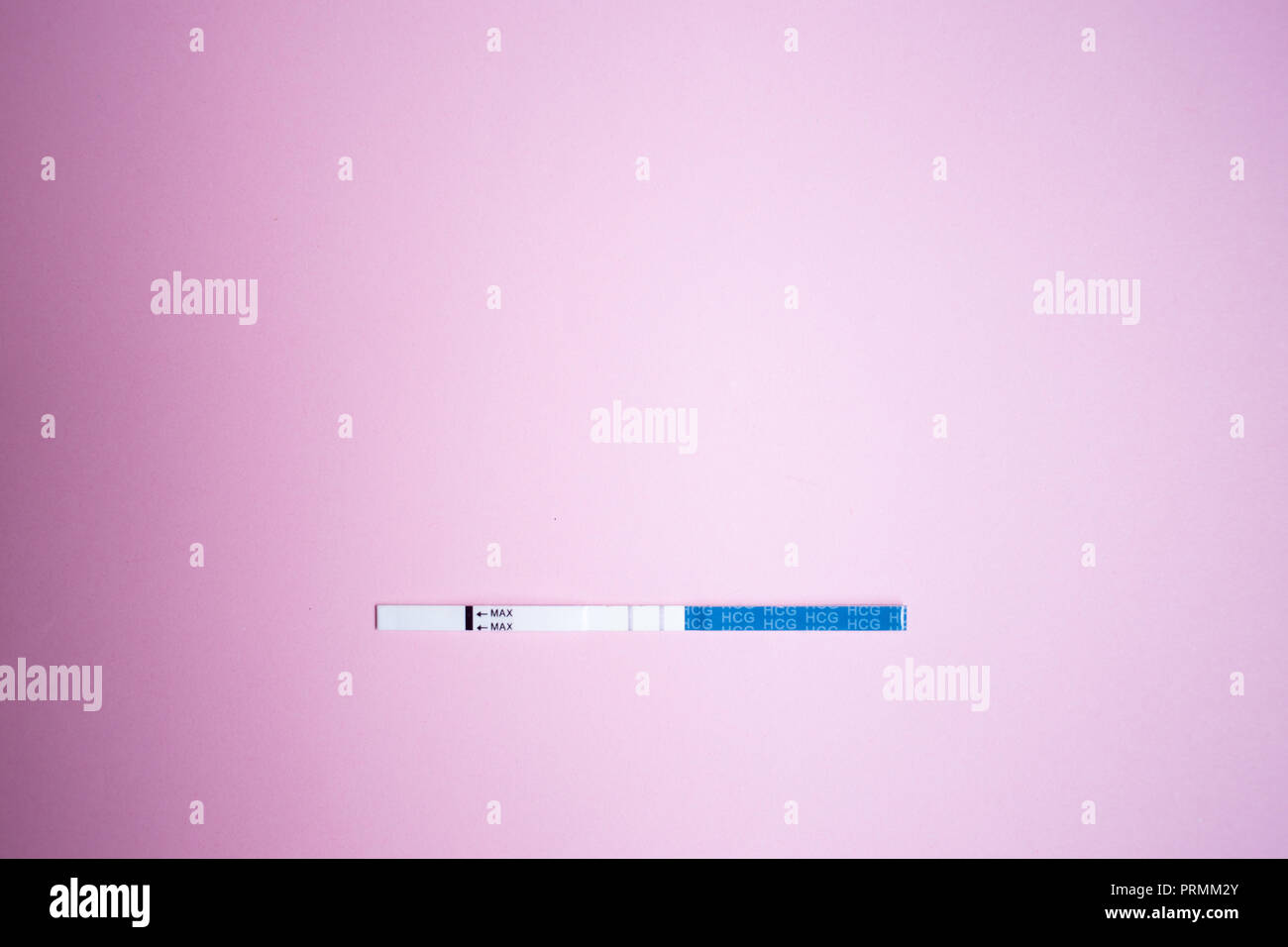 Positive pregnancy test with two strips. pink background, copy space ...