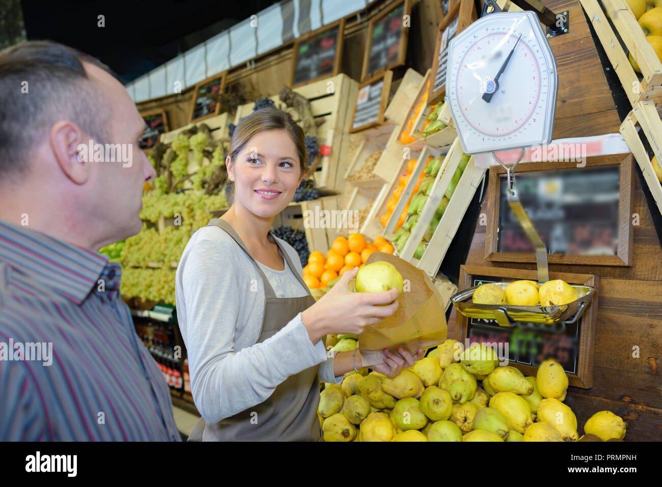 giving fruits to the client Stock Photo - Alamy
