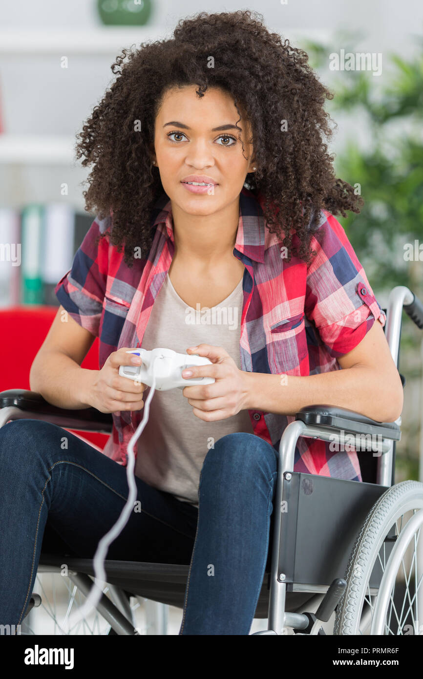 disabled woman playing video game Stock Photo - Alamy