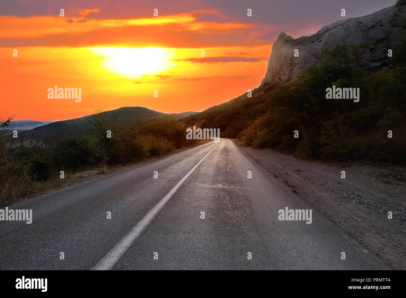 beautiful sunset over the country mountain highway Stock Photo - Alamy