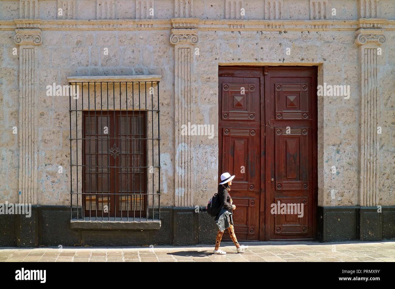 Female Traveler Walking along the Sillar Stone Vintage Buildings of the ...
