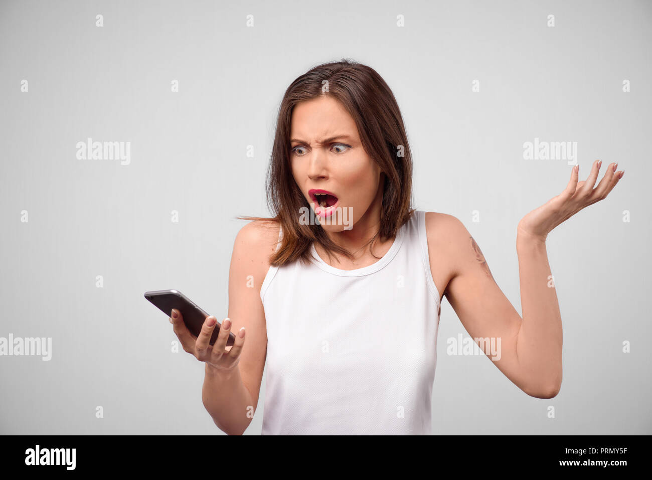 Irritated Face Expression On Phone