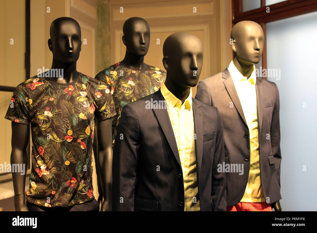 Four male, robot-like clothes mannequins stare, eerily, out from the ...