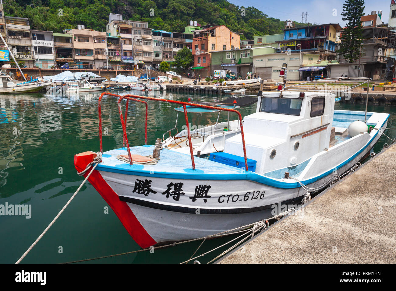 Keelung, Taiwan - September 5, 2018: White wooden fishing boat moored ...