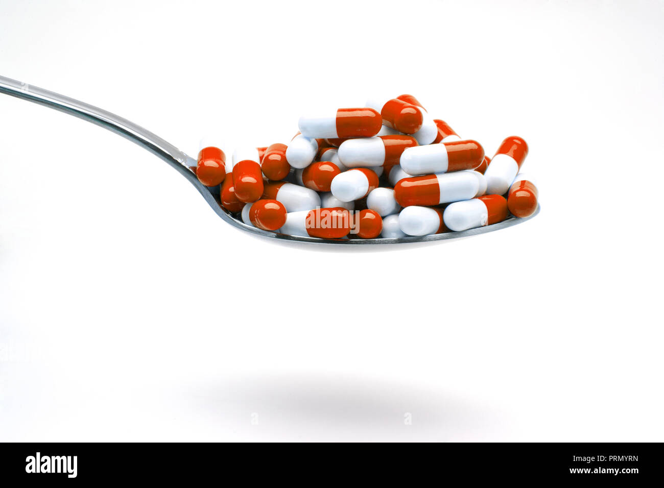 dosage of capsules red and white Stock Photo - Alamy