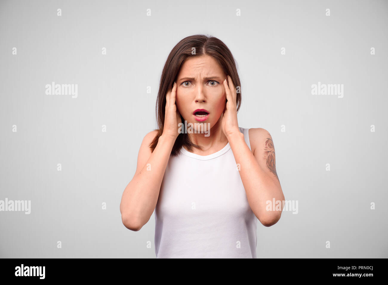 Horrible, stress, shock. Female half-length portrait isolated at gray ...