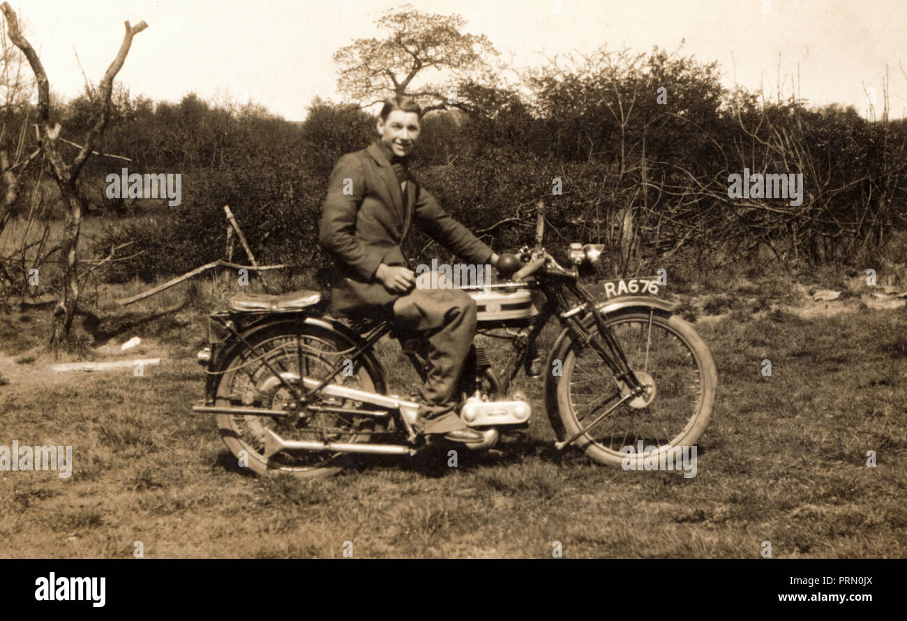 Man sitting on his 1925 Triumph 500cc Single motorcycle in the garden ...