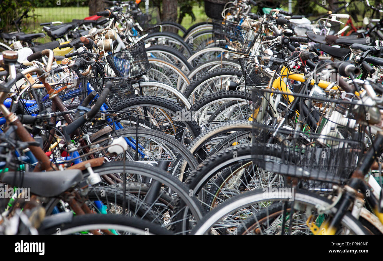 bikes piled up and disordered in parking Stock Photo - Alamy