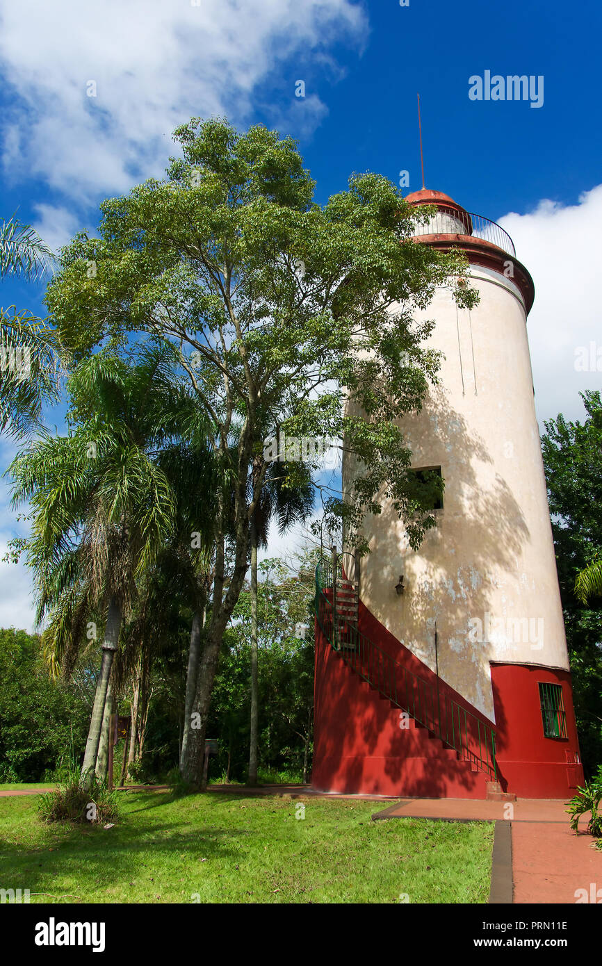 Building of the lighthouse surrounded by tropical plants Stock Photo ...