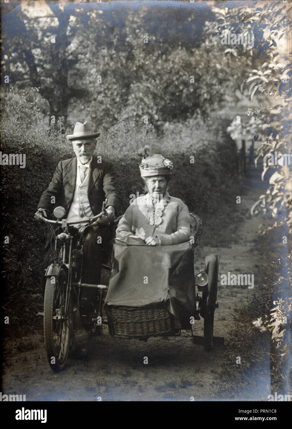 Lady & gentleman on a 1910 Triumph H 500cc motorcycle & wicker sidecar ...