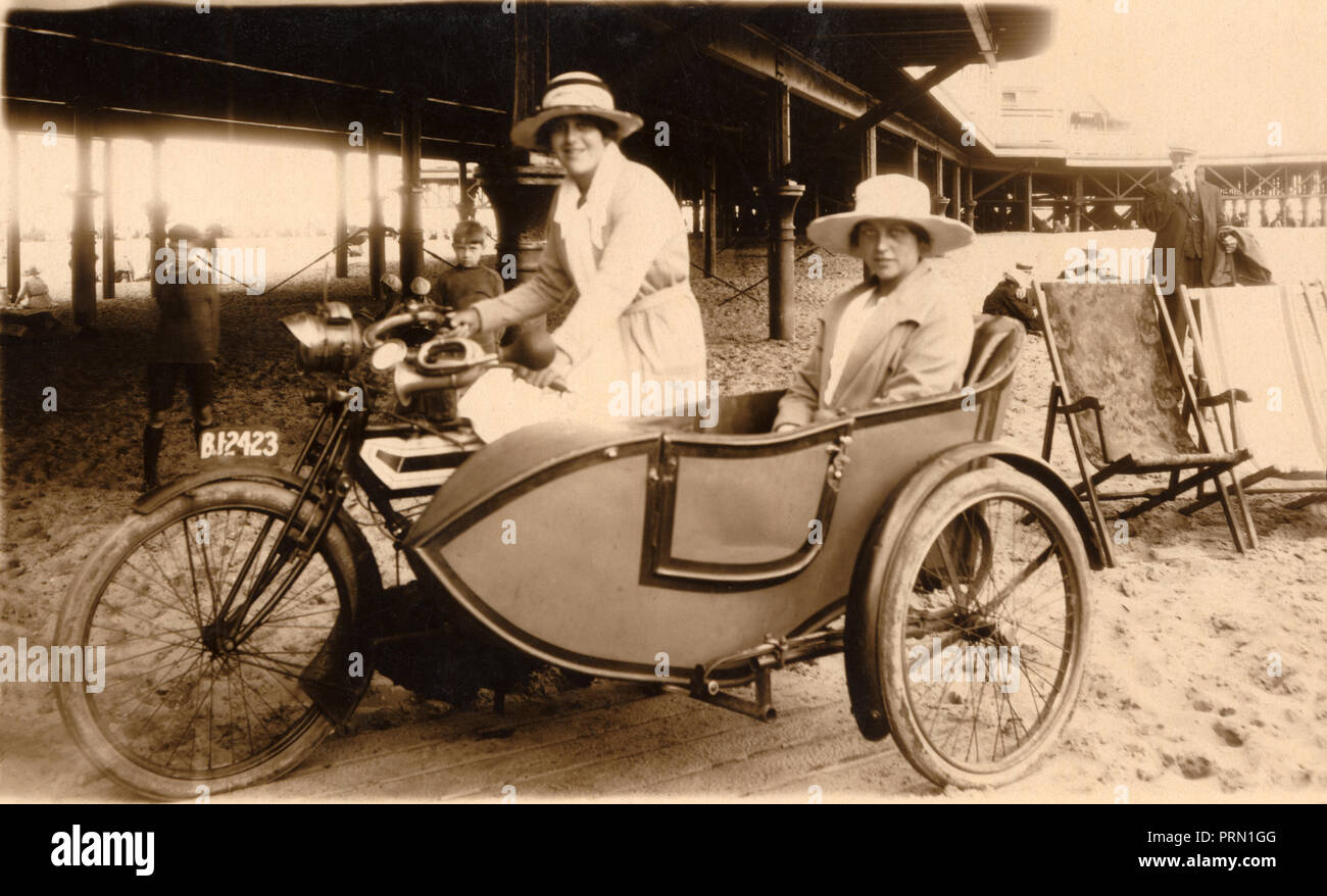 Two ladies pose for photograph on a 1910 Triumph H motorcycle & sidecar ...