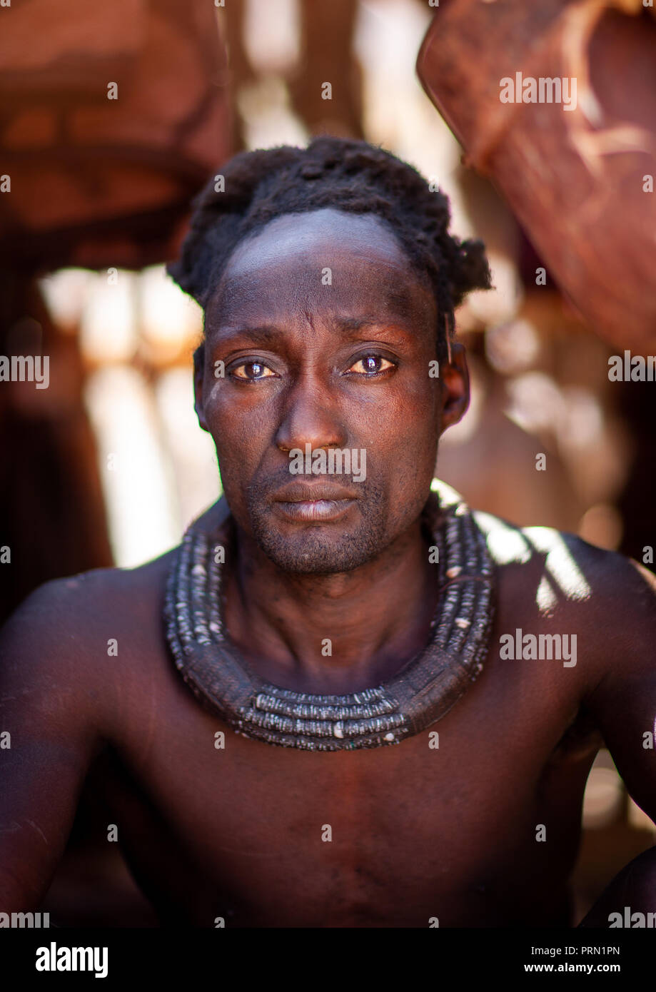Himba tribe man with the traditional necklace, Cunene Province, Oncocua ...