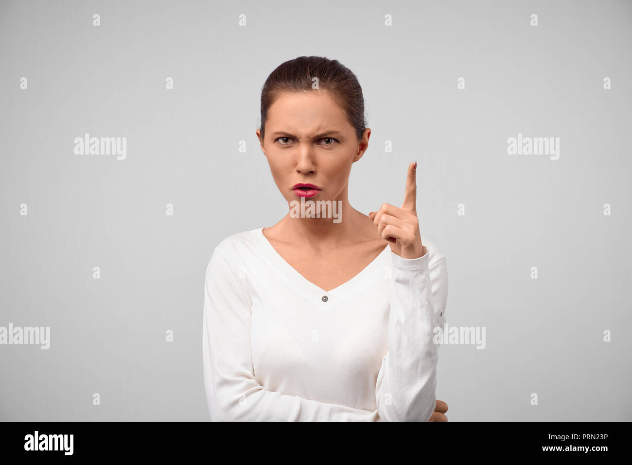Portrait of unhappy Caucasian brunette woman boss having mad expression ...