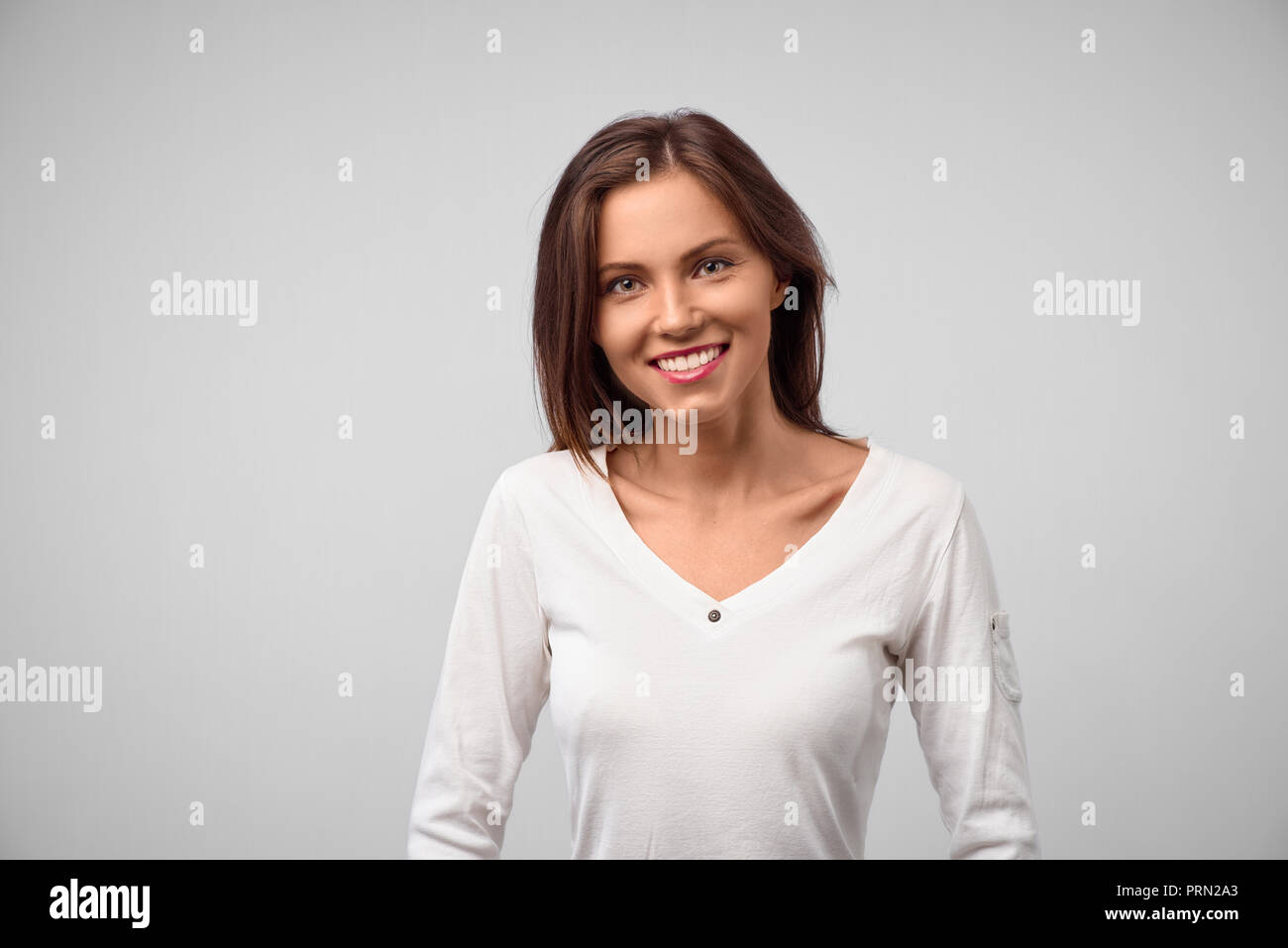 Portrait of cheerful beautiful woman having dark charming eyes and ...