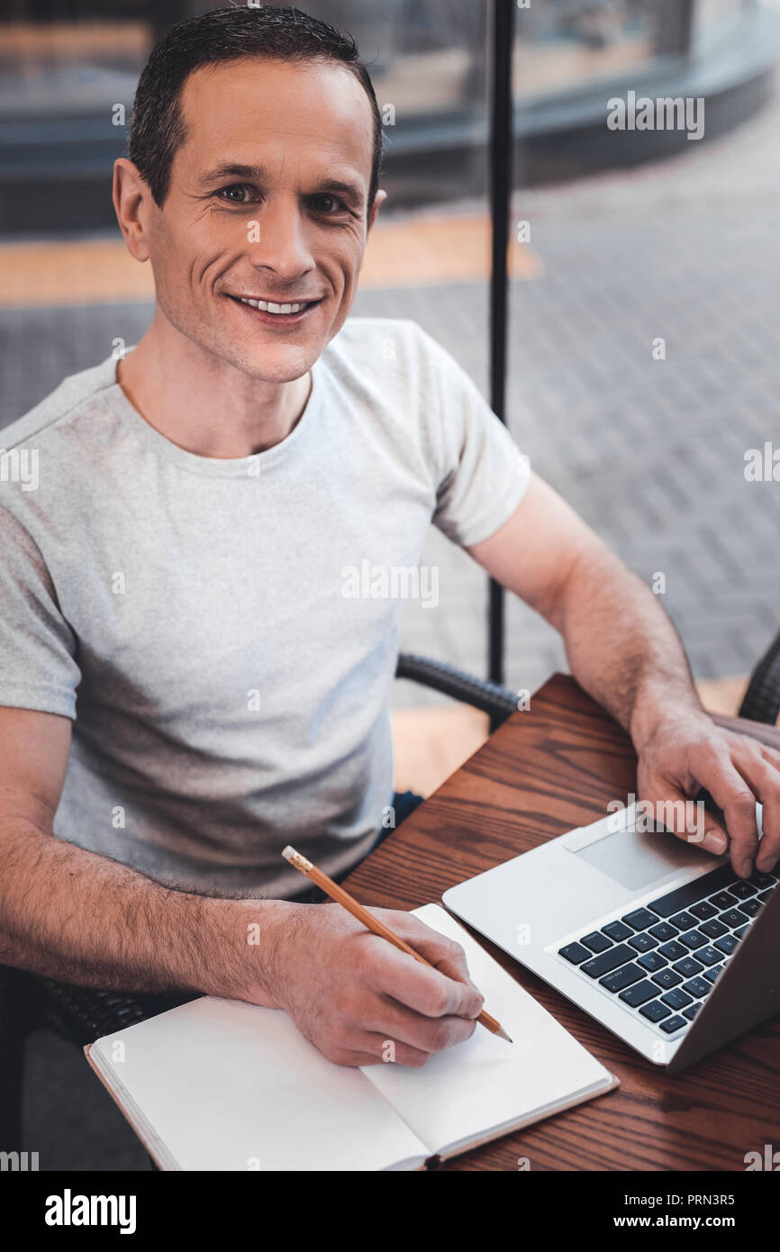 Portrait of delighted man that posing on camera Stock Photo - Alamy