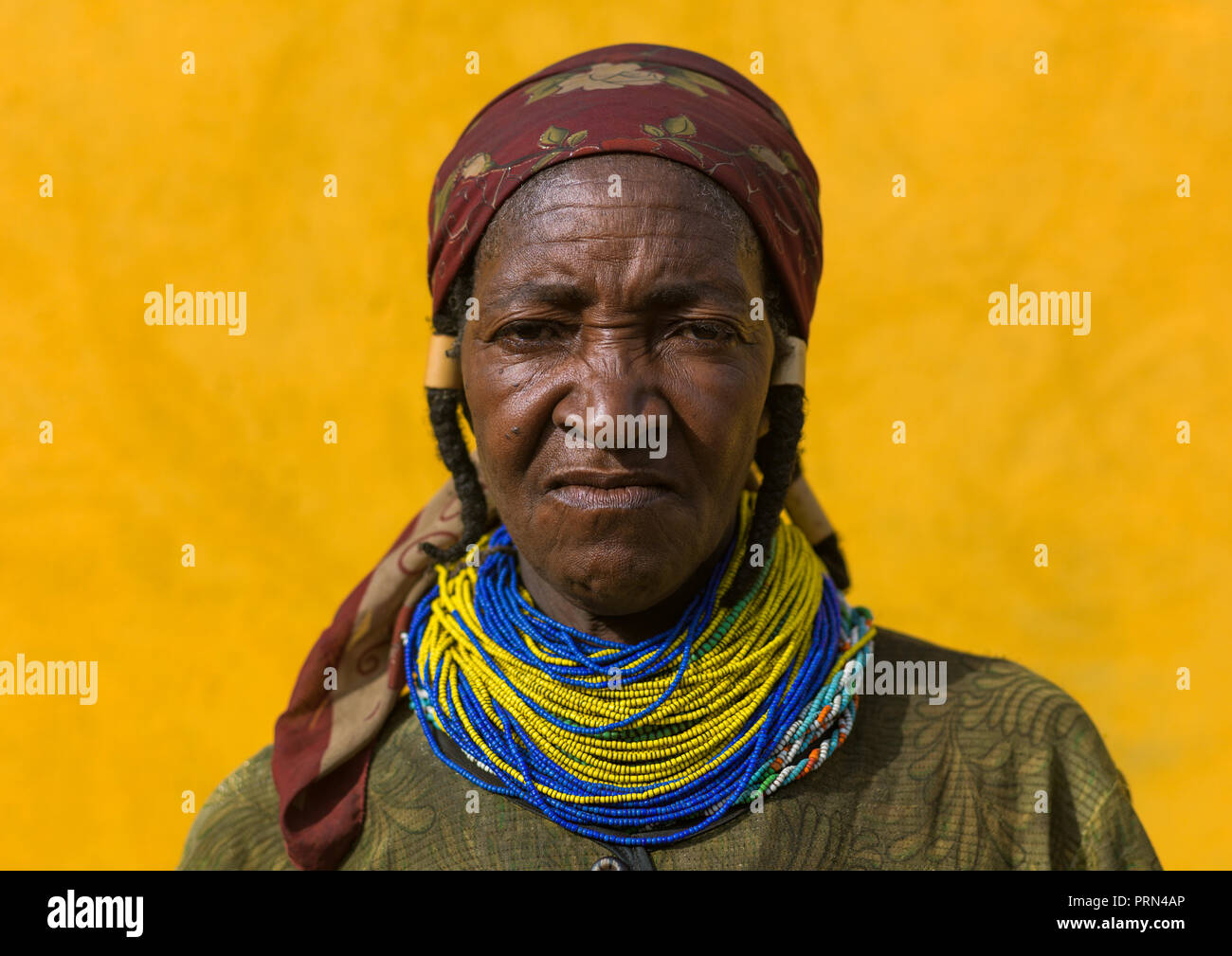 Mumuhuila tribe woman portrait dressed in western clothes, Huila ...