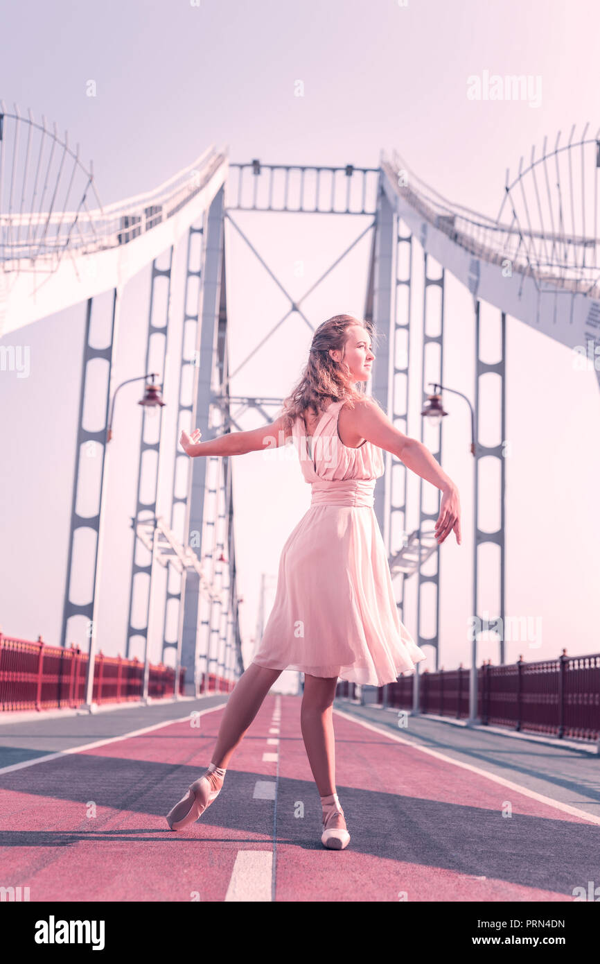 Beautiful nice woman standing on the bridge Stock Photo - Alamy
