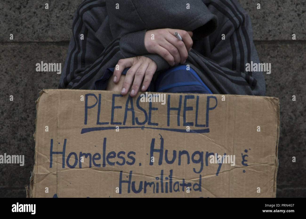 Homeless man reaches out for help on a sidewalk in midtown Manhattan ...