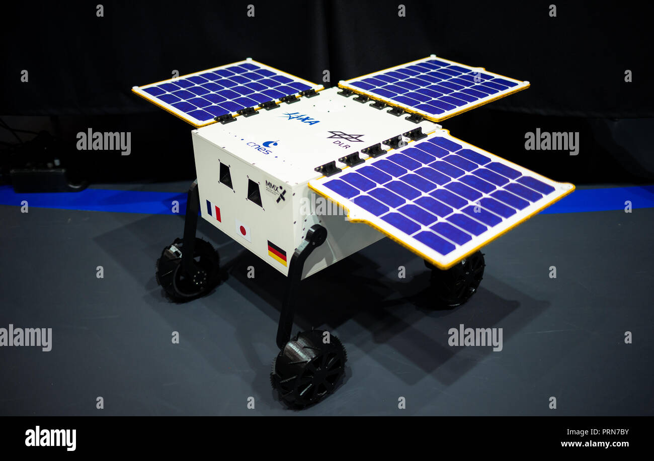 03 October 2018, Bremen: A look at a model figure of the MMX rover ...