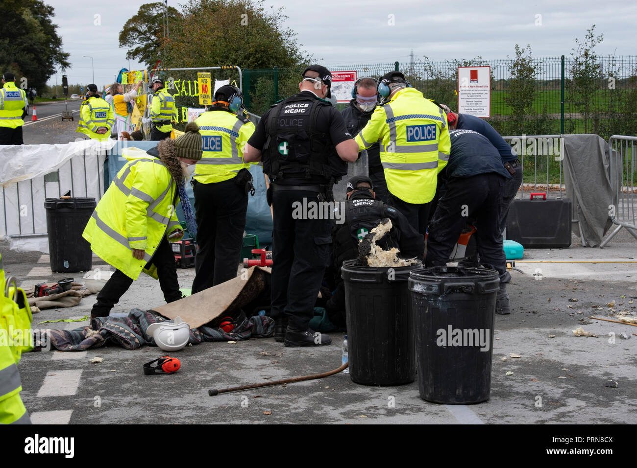 Plumpton, Blackpool, UK. 3rd Oct, 2018. Anti-fracking protester cut ...