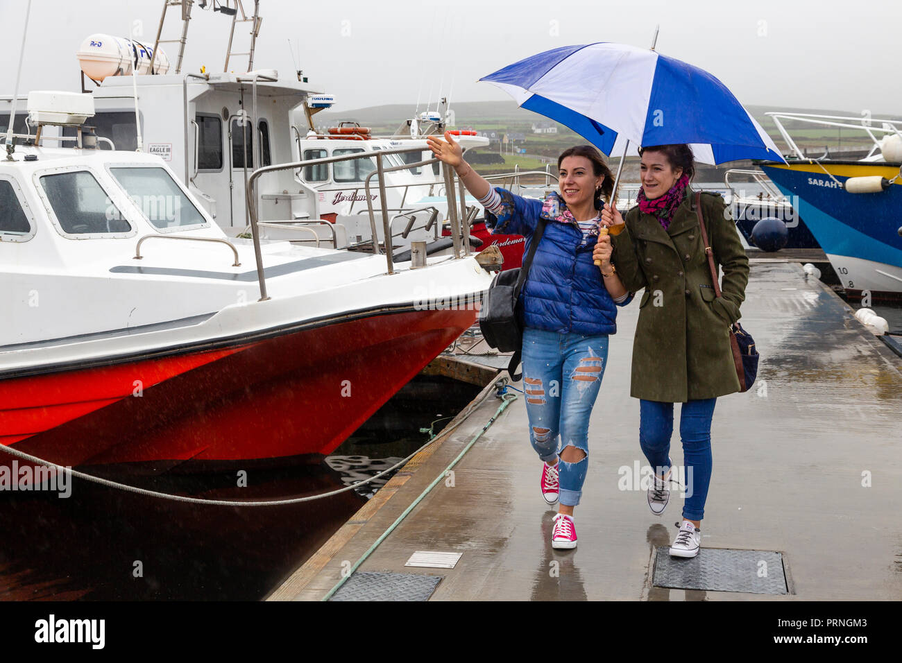 Women walking out in very windy day hi-res stock photography and images ...