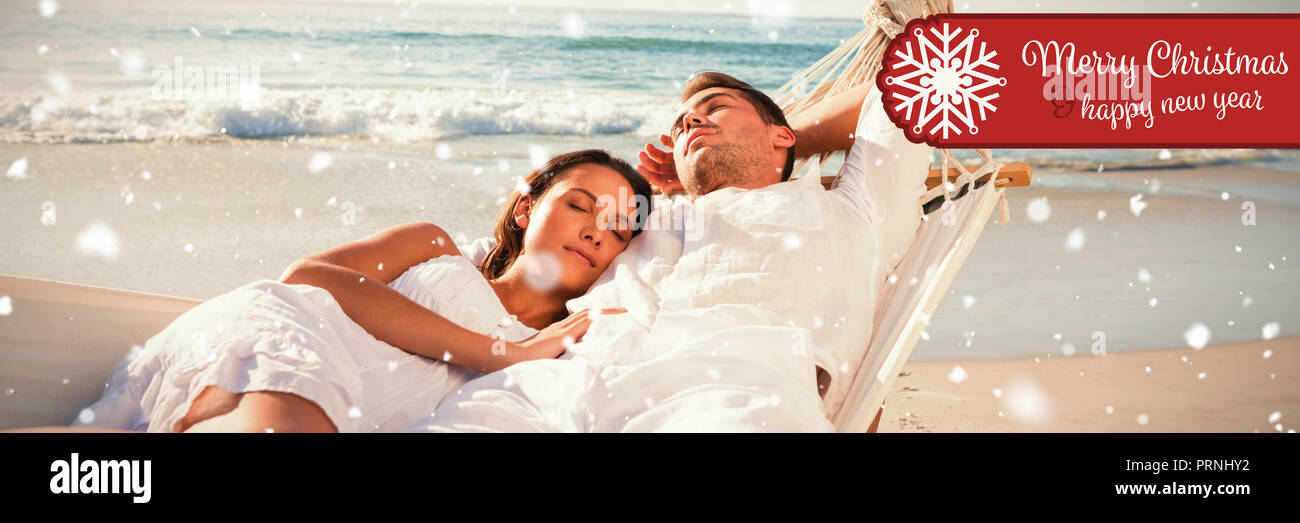 Composite image of calm couple napping in a hammock Stock Photo - Alamy