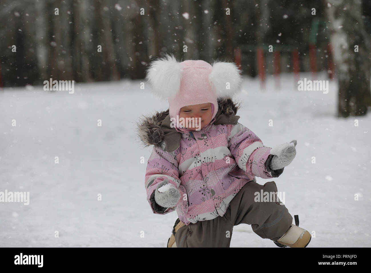Children walk in the park in winter. Winter forest a family with Stock ...