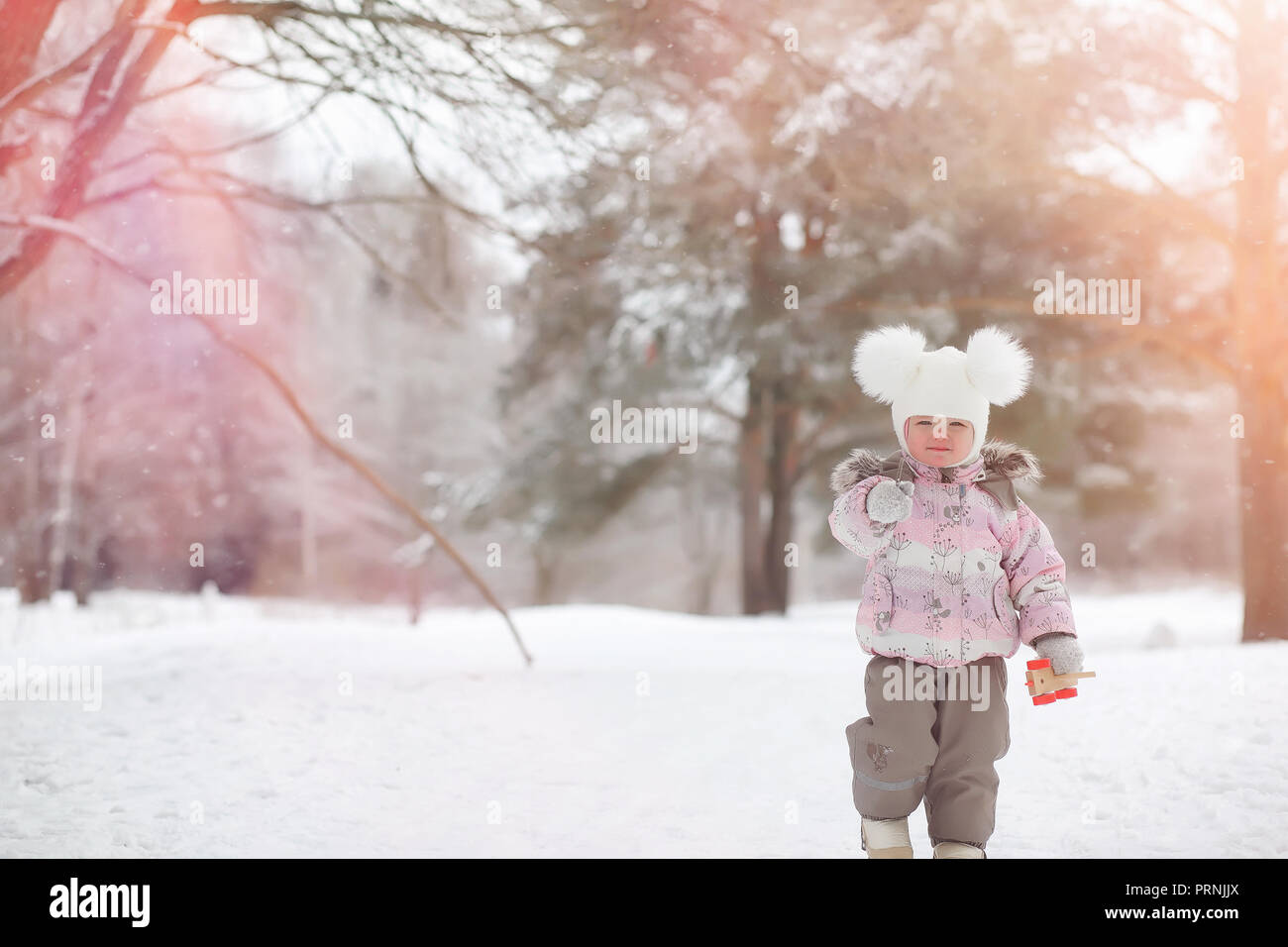 Children walk in the park in winter. Winter forest a family with Stock ...