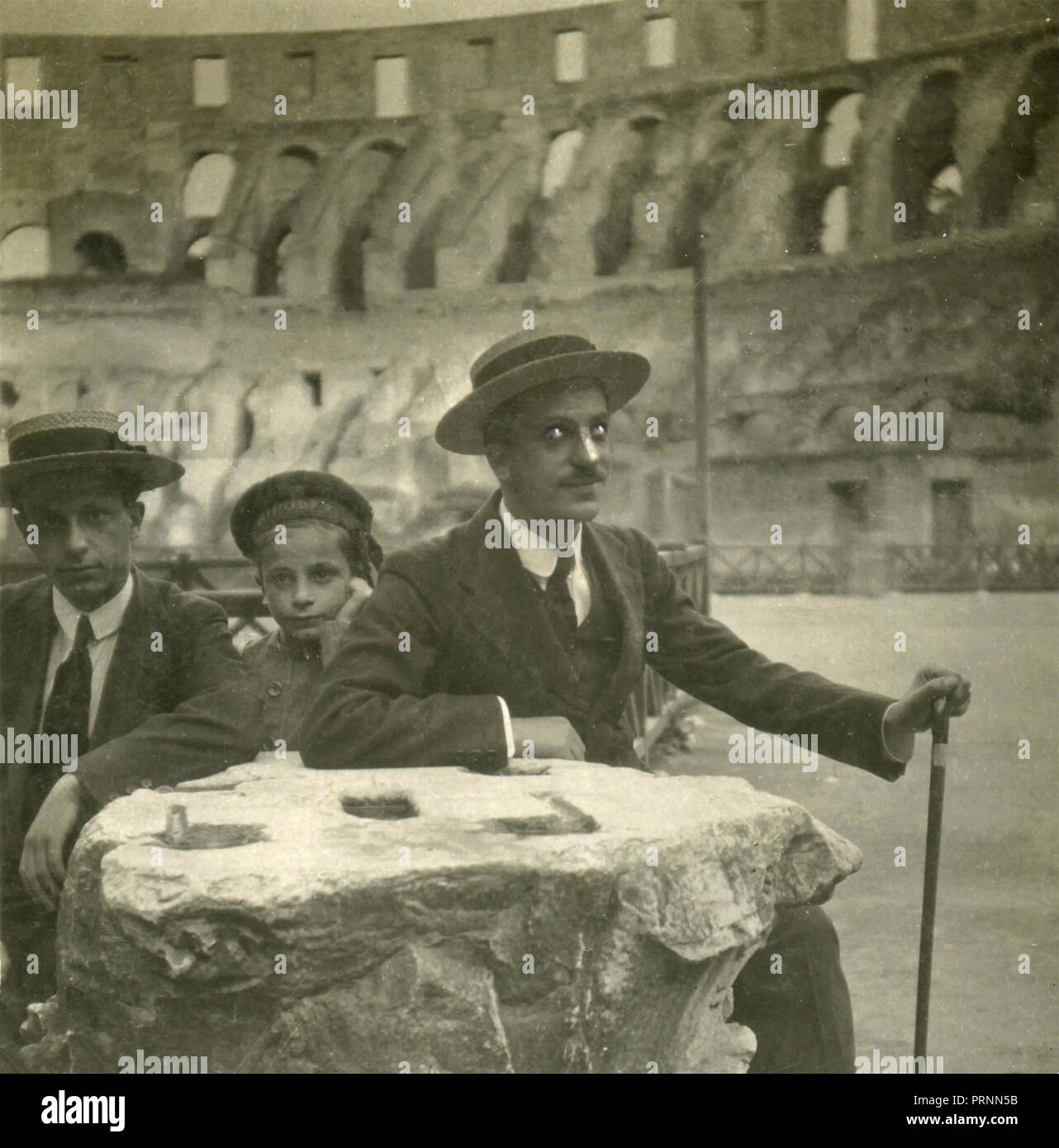 Father and children inside the Colosseum, Rome, Italy 1910s Stock Photo ...