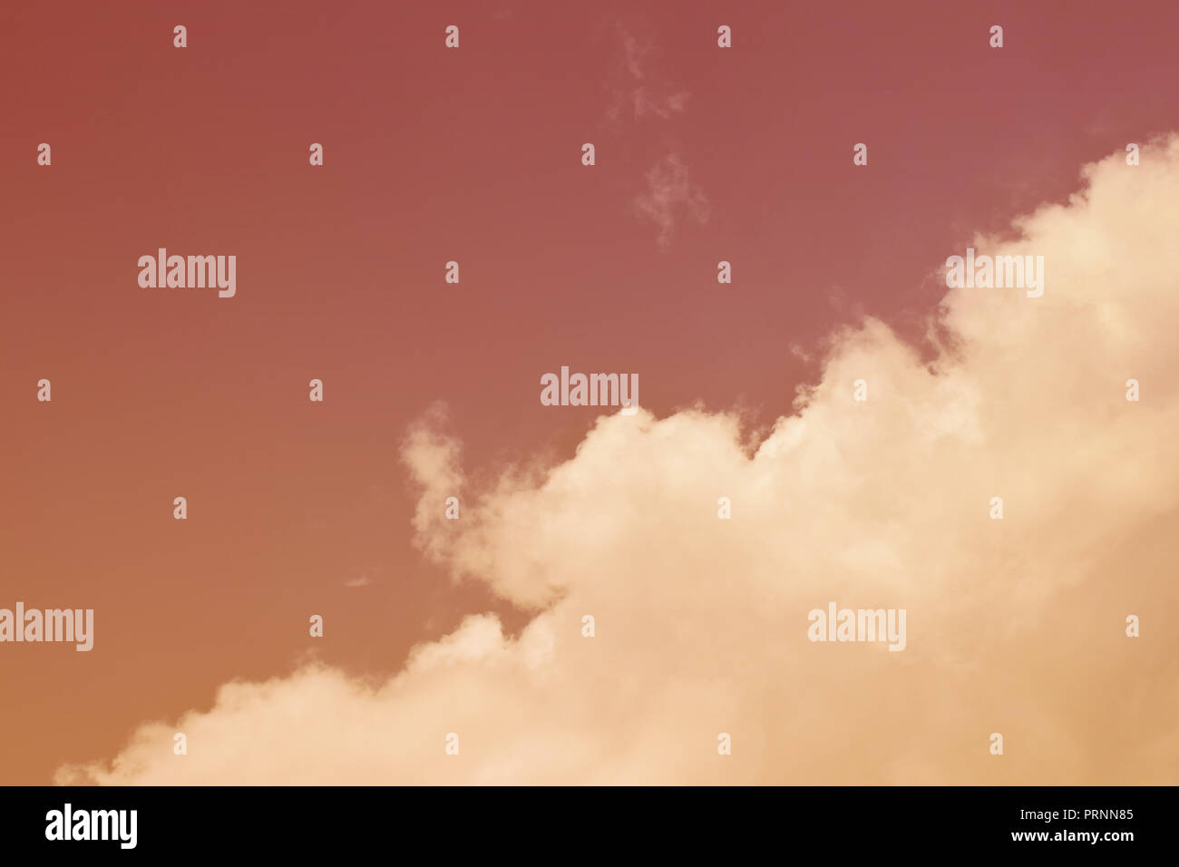 Nature background. Fluffy soft clouds in sky toned Stock Photo - Alamy