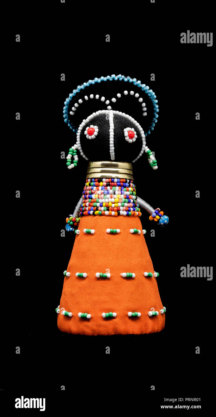 Traditional south africa doll isolated on black background Stock Photo ...