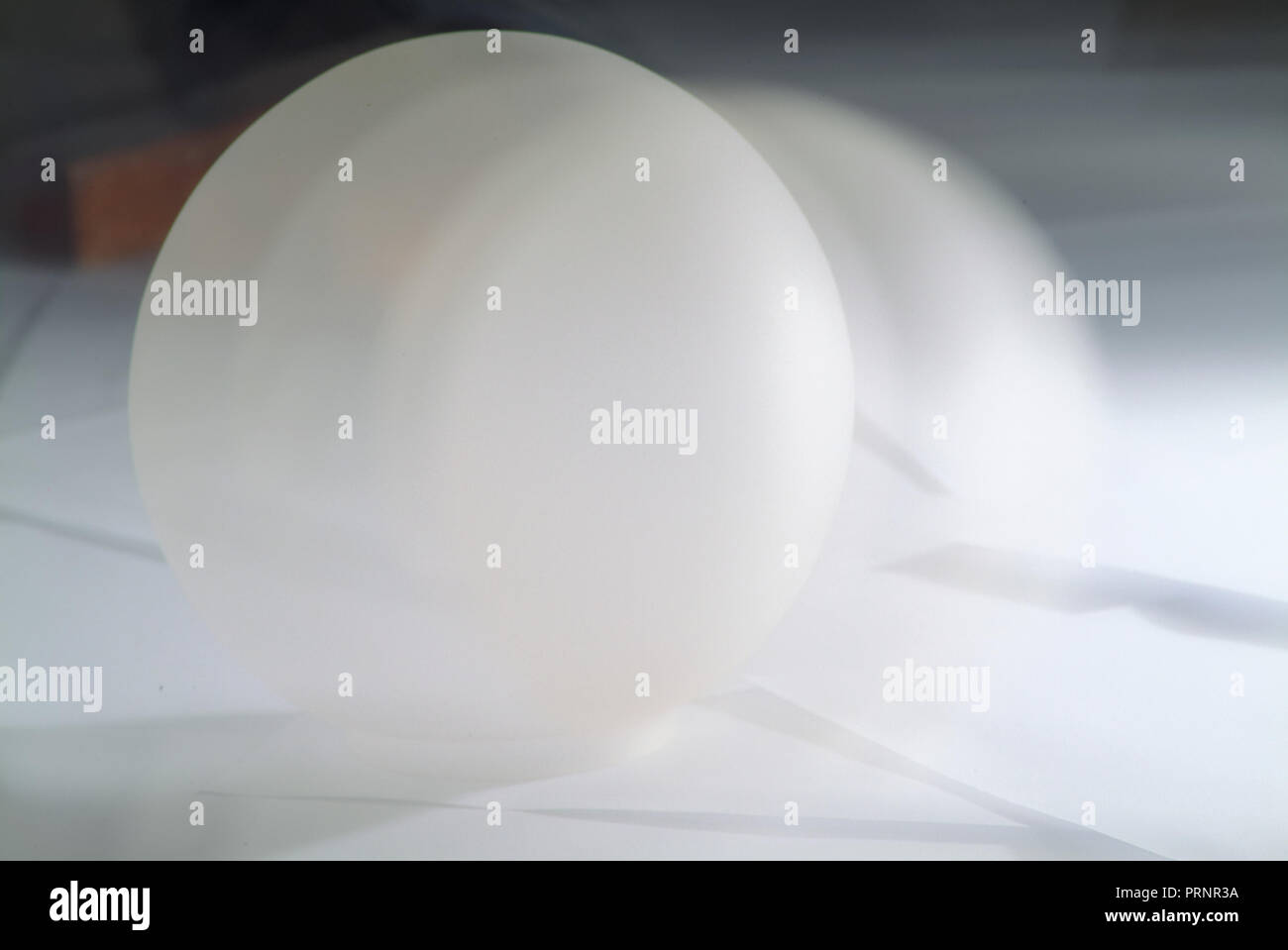 Multi-exposure. the white ball Stock Photo - Alamy